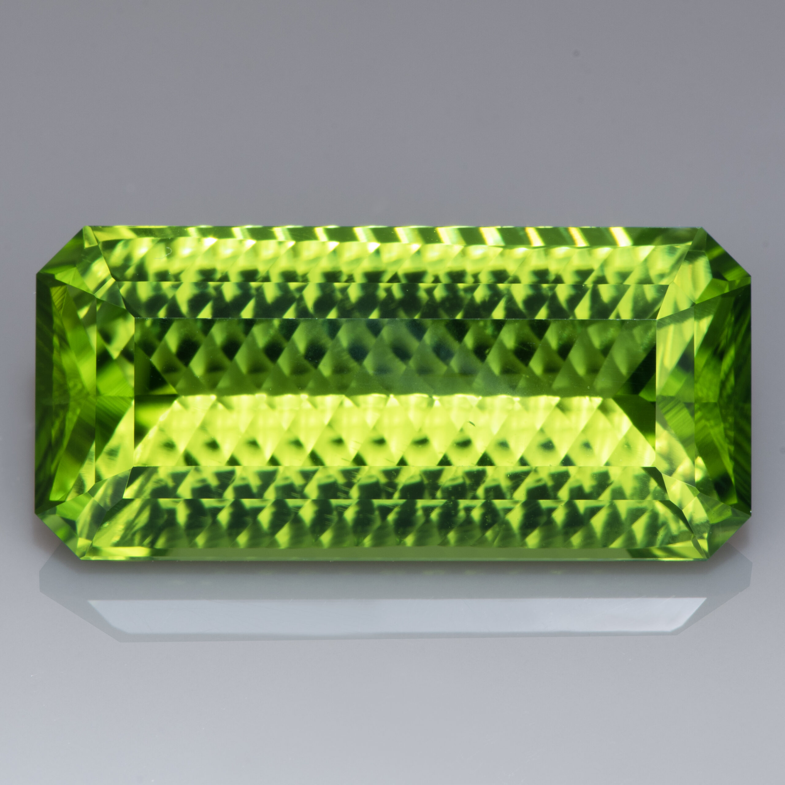 10.64ct Peridot, Radiant Cut · Astrological Gem International